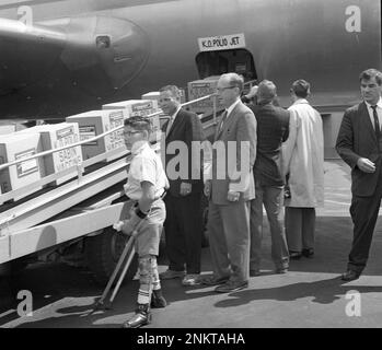 Polio victim Larry Montoya, is at the airport for the arrival of cases ...