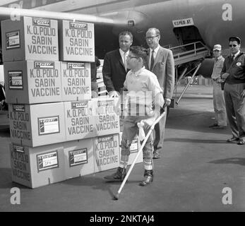 Polio victim Larry Montoya, is at the airport for the arrival of cases ...