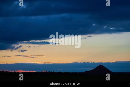 Sunset over the spoil tip, slag heap, terril, terrikon, coal mine ...
