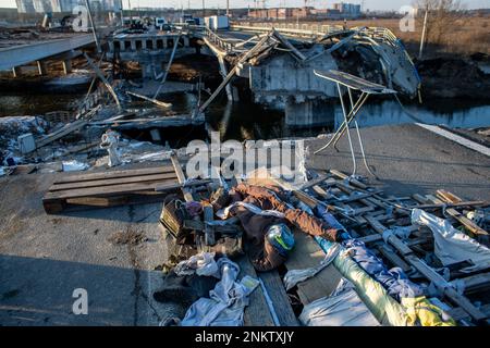 The destroyed, demolished, bridge over the Irpin River in the town of ...