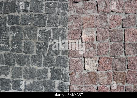 Rubble gray and brown square stones paved road with a horizontal border ...