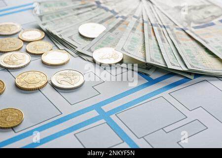 Coins on cadastral map of territory with buildings, closeup Stock Photo ...