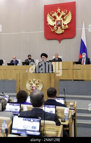In this photo released by The State Duma, Russian lawmakers applaud ...
