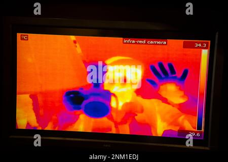 Infrared image picture taken by a video camera of a photographer with a ...