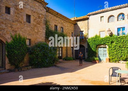 Street of the historic center of Peratalla with arches. Peratallada ...