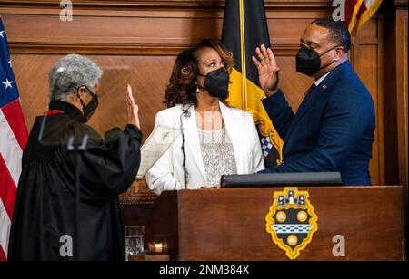 Judge Kim Berkeley-Clark, left, swears in Ed Gainey, right, as the 61st ...