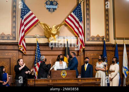 Judge Kim Berkeley-Clark, left, swears in Ed Gainey, right, as the 61st ...