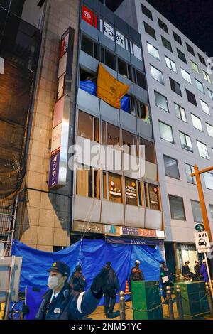 OSAKA, Japan - Police officers investigate a crime scene in Neyagawa ...