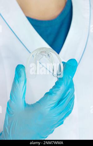 Close-up of orthodontic silicone transparent teeth aligner in female ...