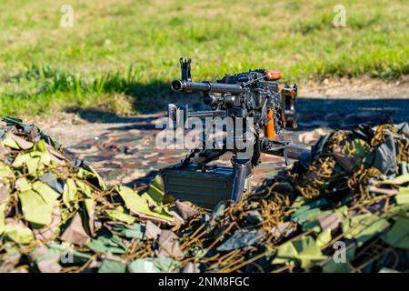 Soviet-made PK machine gun and camouflage netting.. "Kalashnikov's ...