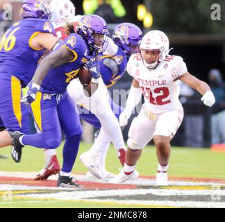 East Carolina's Rahjai Harris (47) fights to retain possession against ...