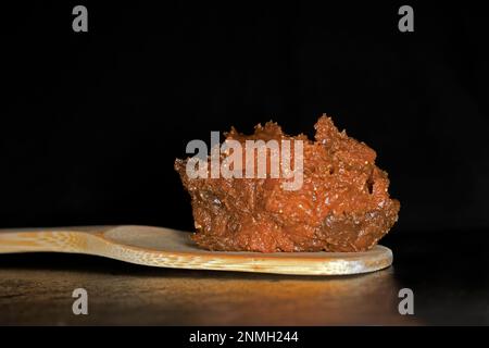Doenjang, traditional fermented Korean soybean paste on a bamboo spoon ...