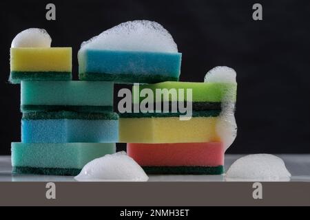 Lined up plaster sponges with foam Stock Photo - Alamy
