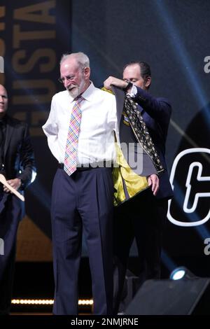 Marc Ratner receives his trophy and his HOF jacket during his induction ...