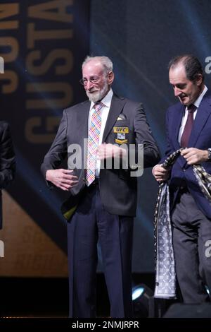 Marc Ratner receives his trophy and his HOF jacket during his induction ...