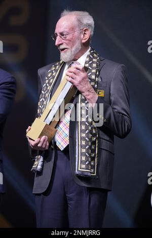 Marc Ratner receives his trophy and his HOF jacket during his induction ...