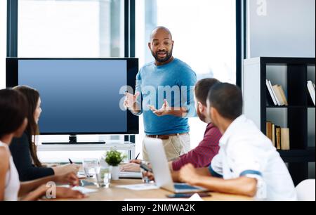 Allow me to explain. a young businesswoman giving a presentation Stock ...