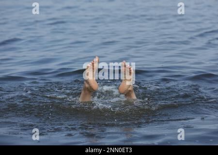 Woman drowning in sea Stock Photo - Alamy
