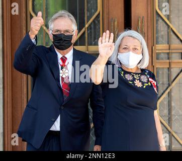 Governor General Mary Simon and her husband Whit Fraser, left, and Canadian Prime Minister ...