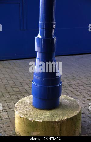 A large bore pipe channelling waste water down into a surface drain ...