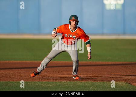 Miami Hurricanes Gabe Rivera (43) high fives teammates after hitting a ...