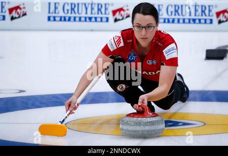 Team Canada third Val Sweeting, right, makes a shot as lead Briane ...