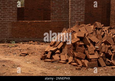 A pile of burnt mud bricks, a common building material in Africa, in ...