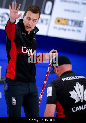 Team Canada skip Brendan Bottcher, center, makes a shot as lead Karrick ...