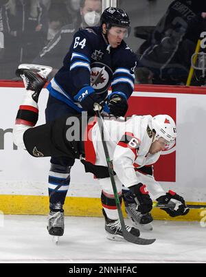 Winnipeg Jets' Logan Stanley (64) fights with Vegas Golden Knights ...