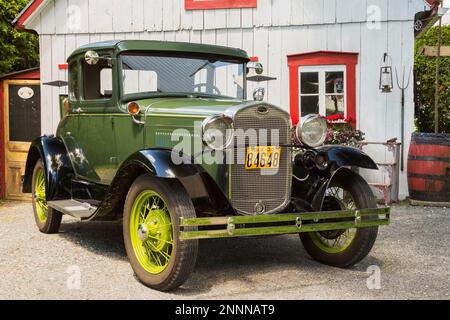 A green 1930 Ford Model A coupe at a classic car show. Tauranga, New ...