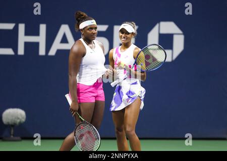 Whitney Osuigwe and Hailey Baptiste react during a women's doubles ...