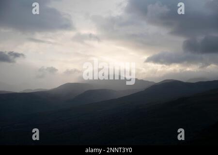 View from Ben Aan with dark cloudy sky, The Trossachs, Scottish ...