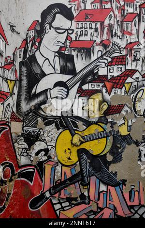 Graffito or mural painting, fado musician, Alfama quarter, Lisbon ...