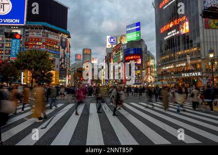People cross the Shibuya crossroads, most frequented crossroads in the ...