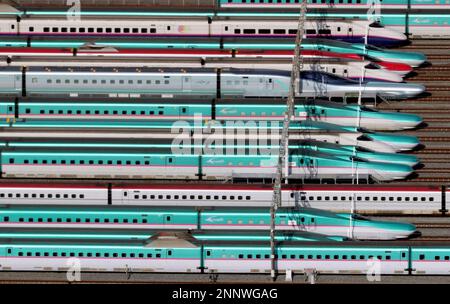 An aerial shows Shinkansen bullet trains lined at the JR East ...