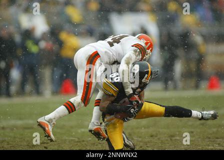 5 Jan 2003: Robert Griffith of the Cleveland Browns hits Hines Ward of ...