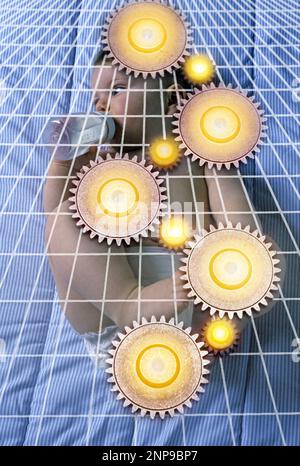 INTERLOCKING COG GEARS ABOVE INFANT BABY LAYING DOWN Stock Photo - Alamy