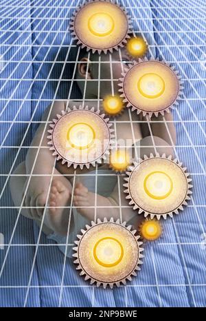 INTERLOCKING COG GEARS ABOVE INFANT BABY LAYING DOWN Stock Photo - Alamy