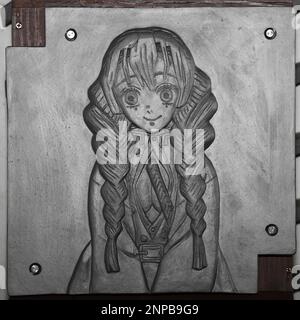 A character of the Demon Slayer, Kimetsu no Yaiba, is carved on ...