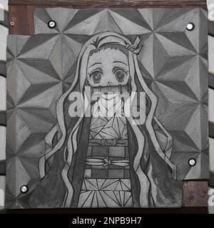 A character of the Demon Slayer, Kimetsu no Yaiba, is carved on ...