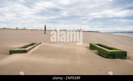 An Iron Man on a windy Crosby beach near Liverpool seen in August 2022 ...
