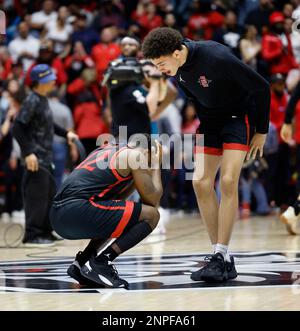 San Diego State's Darrion Trammell (12) jumps onto Lamont Butler after ...