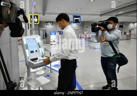A customs officer demonstrates to use an Electronic Customs Declaration ...