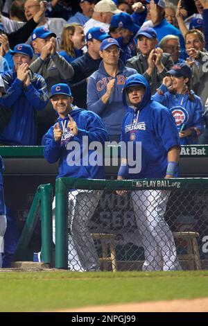 Chicago Cubs' David Ross, left, hugs teammate Kris Bryant on the bench ...