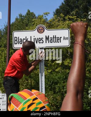 McComb, Miss., Selectman Devante Johnson, left, stands with Black Lives ...