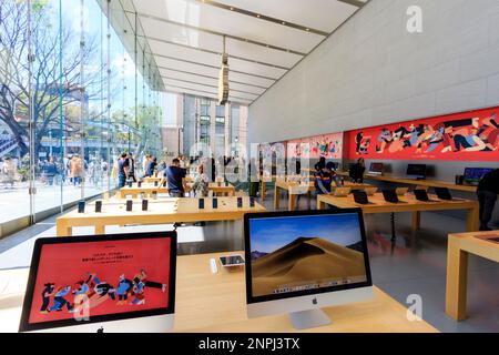 Interior of the Apple store in Omotesando, Tokyo. People looking at the ...