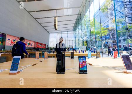 Interior of the Apple store in Omotesando, Tokyo. People looking at the ...