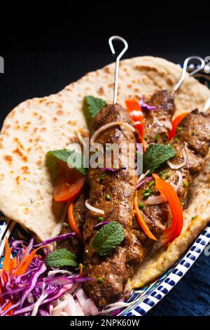 Food concept homemade Shish kofta Kebab on black slate stone background ...