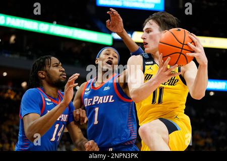 Marquette's Tyler Kolek looks to pass during an NCAA college basketball ...