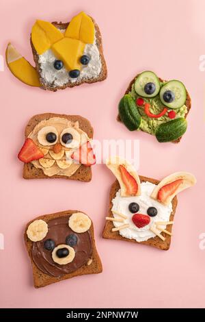 Funny animal faces toasts for kids lunch Stock Photo - Alamy
